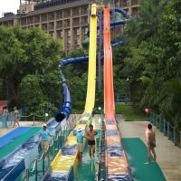 China High-Speed Fiberglass Water Slide 8m Height 65m Length for Amusement Parks with 180 Guests/Hour Capacity for sale
