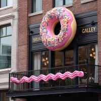 China Life-Size Pink Donut FRP Sculpture 150cm H Customizable Fiberglass Decor for sale