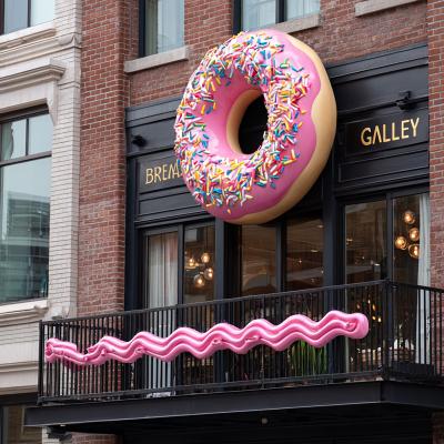 China Life-Size Pink Donut FRP Sculpture 150cm H Customizable Fiberglass Decor for sale