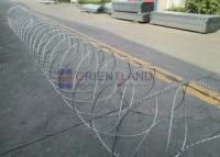 China Anti Corrosive Galvanized Razor Wire BTO11 BTO22 BTO30 Concertina Coil 450mm 56 Loops for sale
