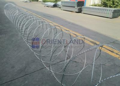 China Anti Corrosive Galvanized Razor Wire BTO11 BTO22 BTO30 Concertina Coil 450mm 56 Loops for sale