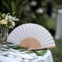China 23cm White Wooden Folding Fan with Engraved Logo for Wedding Painted Decoration for sale