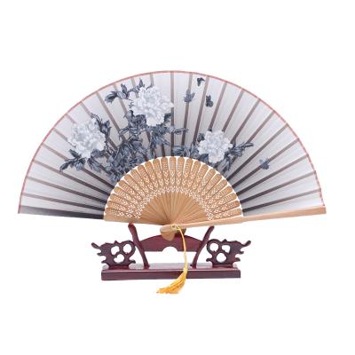 China Traditional Chinese Bamboo Folding Fans Adorned with Floral Motifs Serve As Decorative Pieces for Indoor Display or As Gifts for sale