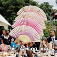 China Hot Selling Carved Bamboo Folding Silk Material Wedding Fans for Gifts for sale