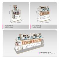 China Skincare Display Fixtures White Wooden Sample With Island Embedded Light Strip For Branding Shop Stand And Premium Store Interior Design for sale