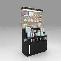 China Black Gold Display Showcase Cosmetic Shop Display Rack with Light Strips for Perfume Shop Display and Cosmetic Store Interior Design for sale
