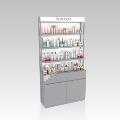China Gray Wooden Display Cabinet Multilayer Store Rack With Light-box For Skincare Store Design for sale