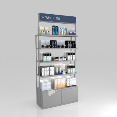 China Skincare Store Stand  Grey Transparent Low Cabinet With Double-Sided Light Box For Customized Store Furniture And Trendy Store Interior Design for sale