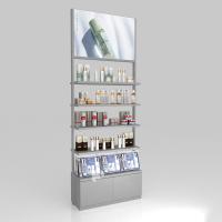 China Makeup Store Counter Grey Transparent High Cabinet With Double-Sided Light Box For Retail Shop Decoration And Space-Saving Display Cabinet for sale