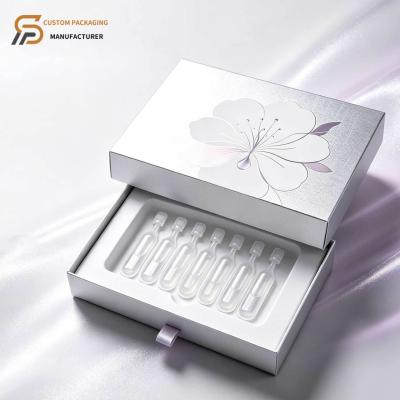 China Custom Silver Sakura Print Cosmetic Gift Box with 7 Ampoule Bottle Insert for Skincare Packaging Box for sale