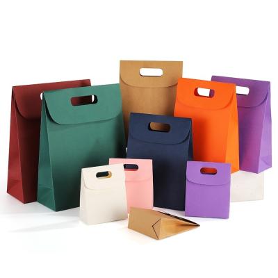 China Wholesale Customizable Candy Kraft Paper Bag Solid Color Flip Cover Handbag with LOGO Gift Paper Bag for sale