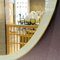 China Modern Luxury Home Decor Metal Framed Mirrors Living Room Oval Wall Gold Mirror for sale