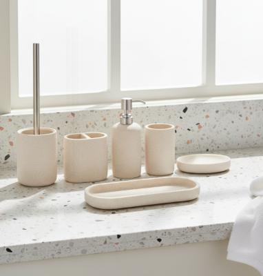 China Sand stone bathroom accessories set round with rock look resin lotion bottle with pump household item for sale