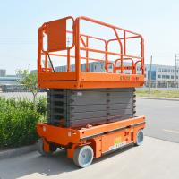 China 25% Grade Ability Motorized Scissor Lift With Foldable Guardrail for sale