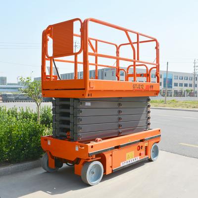 China 25% Grade Ability Motorized Scissor Lift With Foldable Guardrail for sale