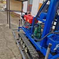 China 150m Depth Percussive And Rotating Type Rubber Crawler Mounted Water Drilling Rig for sale
