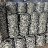 China Military Stronghold PVC Concertina Coil Wire Barbed Spiral Razor Wire for sale