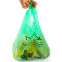 China Custom Logo Printing Punch Handle 50 micron Compostable Biodegradable Starch Bags for sale