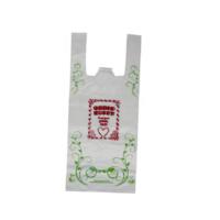 China Printed Bioplastic Shopping Bags Biodegradable T Shirt Bags With Soft Loop Handle for sale