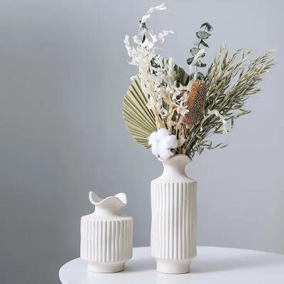 China Wholesale Handmade Modern Irregular Nordic Ceramic Vase White Matte 10x25cm Home Decor Flower Arrangement for sale