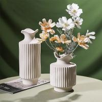 China Wholesale Handmade Modern Irregular Nordic Ceramic Vase White Matte 10x25cm Home Decor Flower Arrangement for sale