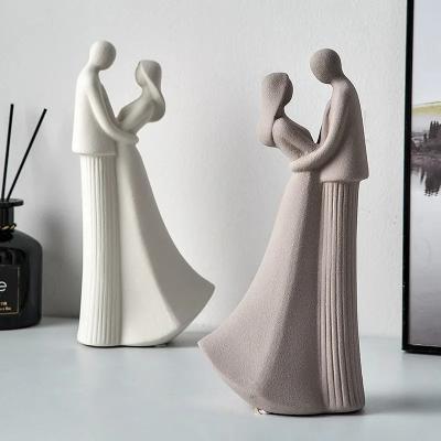 China Ceramic Love Couple Figurines 25.5cm Modern Home Decoration Wedding Gift Ornament for sale