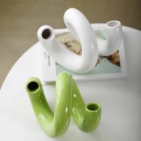 China Modern Ceramic Hollow Donut Flower Vase Twist Pipe Shape Home Decor 22.6x17.7x18cm for sale