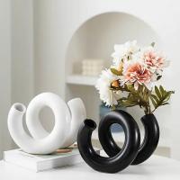 China Modern Ceramic Hollow Donut Flower Vase Twist Pipe Shape Home Decor 22.6x17.7x18cm for sale