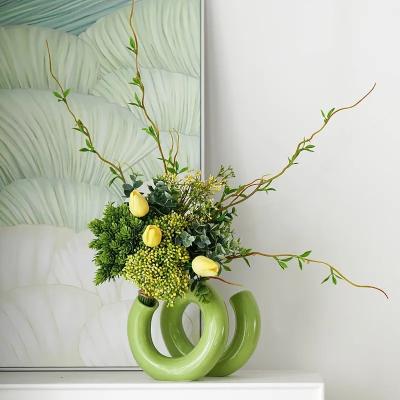 China Modern Ceramic Hollow Donut Flower Vase Twist Pipe Shape Home Decor 22.6x17.7x18cm for sale