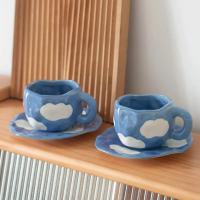 China Hand-painted Ceramic Coffee Cup and Saucer Set 250ml Irregular Mug with Blue Sky White Clouds Design for sale