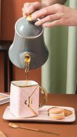 China Creative Ceramic Coffee Cup Saucer Set 310ml Modern Design Business Gift Mug for sale