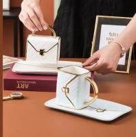 China Creative Ceramic Coffee Cup Saucer Set 310ml Modern Design Business Gift Mug for sale