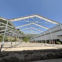 China Galvanized Steel Plastic Film Greenhouse Retractable Large Tunnel Custom for sale