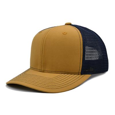 China Custom 6 Panel Pre Curved Brim Mesh Snapback Trucker Cap Cotton Front ISO BSCI for sale