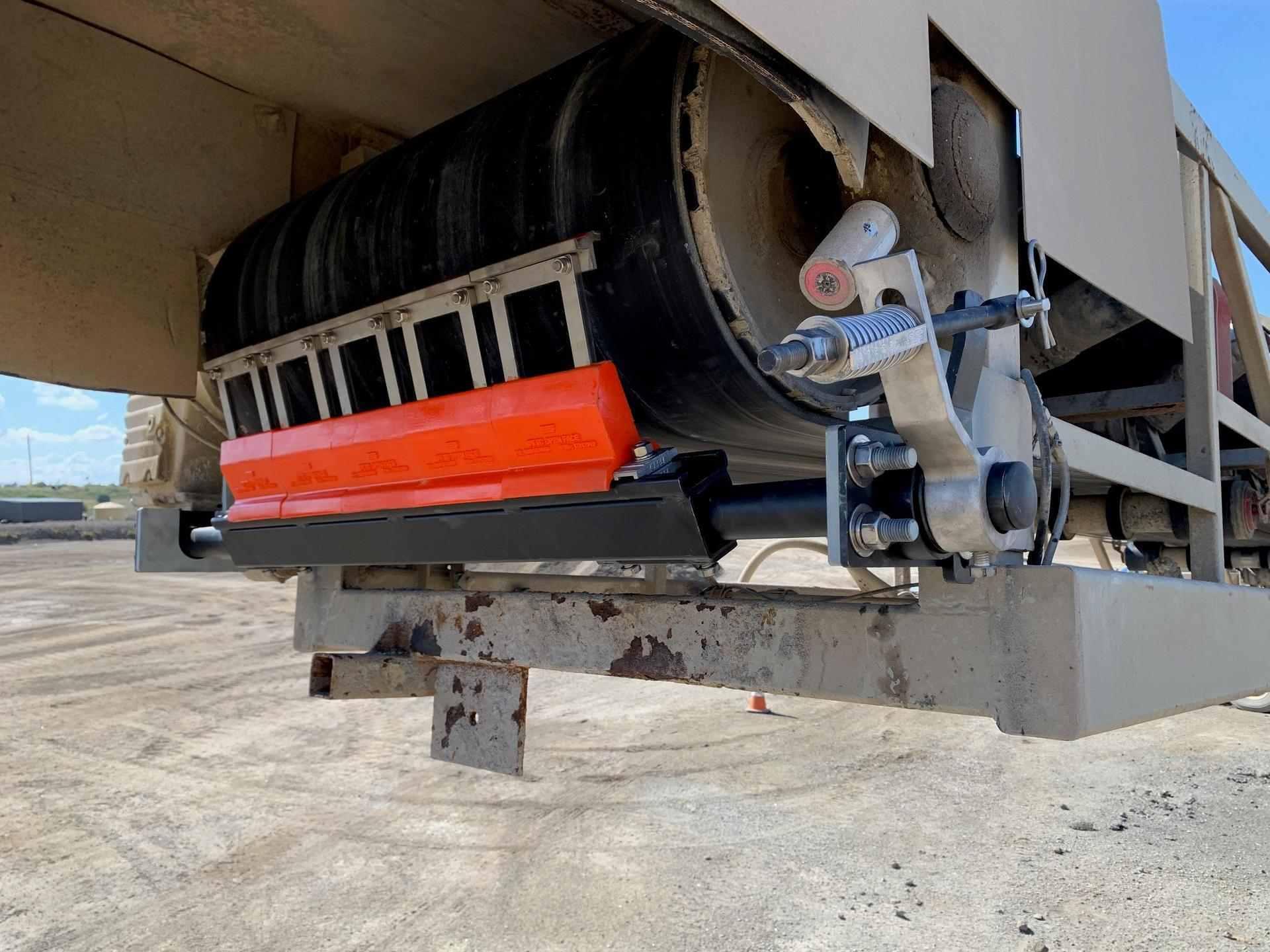 Primary and secondary belt cleaner blades at a discharge pulley