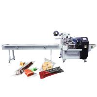 China 400KG Weight Multi-Function Chocolate Foil and Paper Wrapping Machine with Conveyor for sale