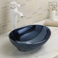 China Sleek And Elegant Oval Ceramic Art Bathroom Sink Counter Top Wash Basin for sale