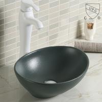 China Sleek And Elegant Oval Ceramic Art Bathroom Sink Counter Top Wash Basin for sale