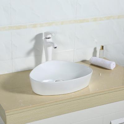 China Prevents Discoloration Fading Irregular Sink White Color Triangle Surface Wash Basin for sale