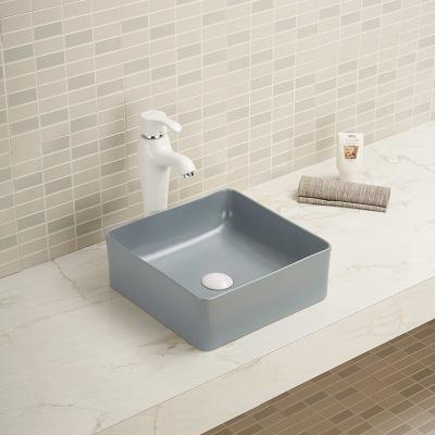 China Dirt Resistant Wash Basin Porcelain Square Shape Complete And Clean Bathroom Sink for sale