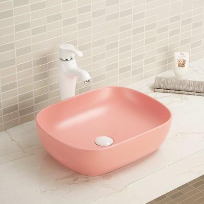 China Not Breeding Bacteria Above Counter Bathroom Wash Basin Pink Easy Clean Ceramic Sink for sale