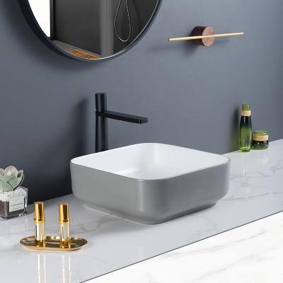 China Non-Porous Surface Counter Top Bathroom Sink Symmetrical Square Wash Basin for sale