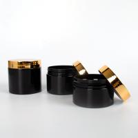 China Wide Mouth PET Round Plastic Canisters 100ml Black Cosmetic Jars With Gold Lid for sale