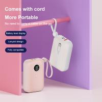 China 10000mAh 22.5W Universal Built In Cable Power Bank Black White Fireproof ABS PC with LED Indicator Lights for sale