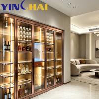 China Curved Rose Gold Stainless Steel Wine Display Cabinet With LED Light for sale