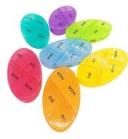 China Oval Shape Pocket Plastic Mini Pill Box Case 28 Compartments 7 Day Pill Storage Box for sale