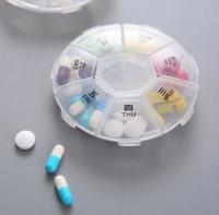 China 7 Compartments Medicine Pill Organizer Round Shape PP Materials Clear Weekly Plastic Pill Box for sale