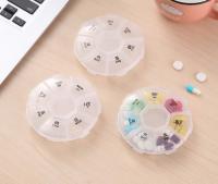 China 7 Compartments Medicine Pill Organizer Round Shape PP Materials Clear Weekly Plastic Pill Box for sale