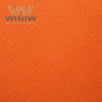 China Competitive Price Orange PVC Synthetic Leather Breathable  Durable luxurious property auto upholstery leather for sale