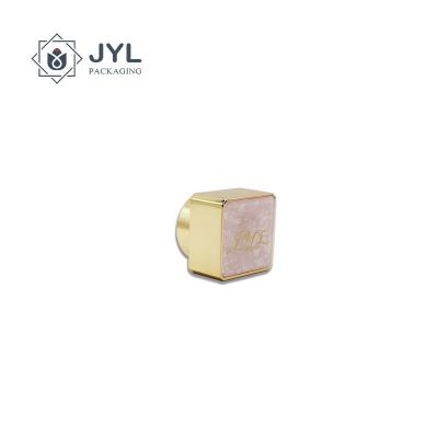 China Zinc Alloy Perfume Cap 24mm with Resin Decorative Top Custom Color for Luxury Bottles for sale